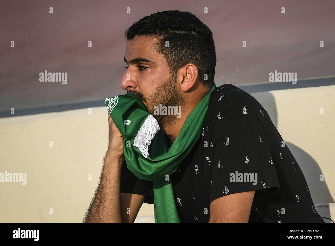 A Saudi Arabian fan weeps after Saudi Arabia national football team was ...