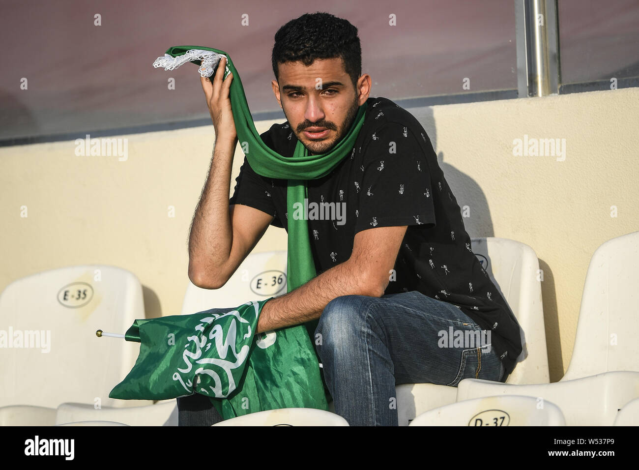 A Saudi Arabian fan weeps after Saudi Arabia national football team was ...