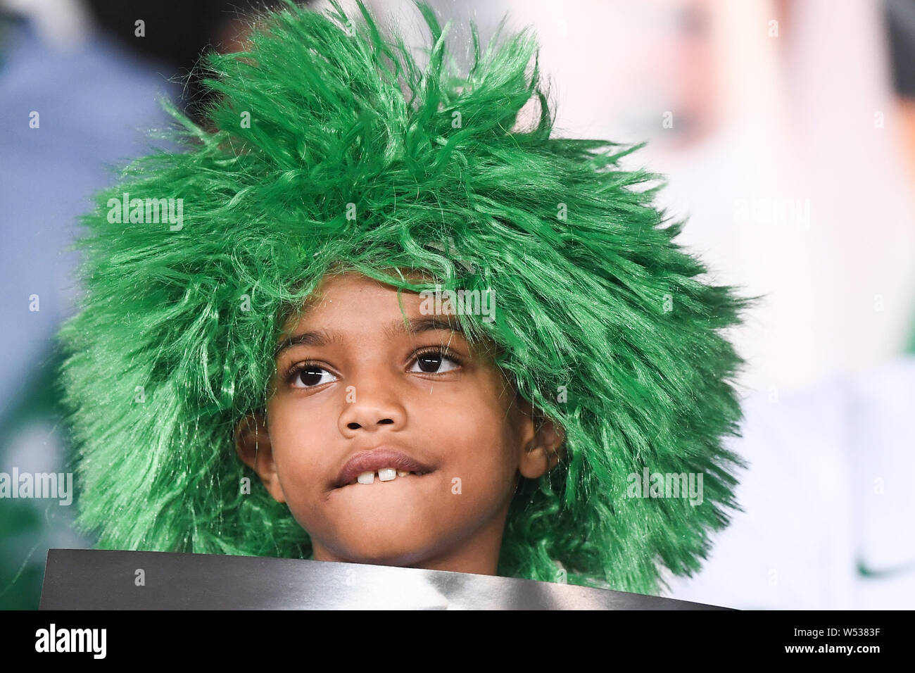 A Saudi Arabian football fan shows support for Saudi Arabia national ...
