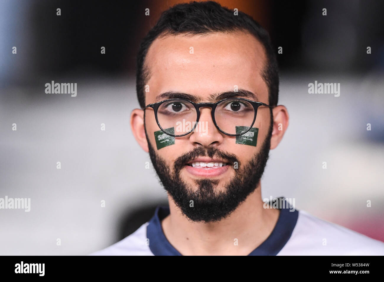 A Saudi Arabian football fan shows support for Saudi Arabia national ...