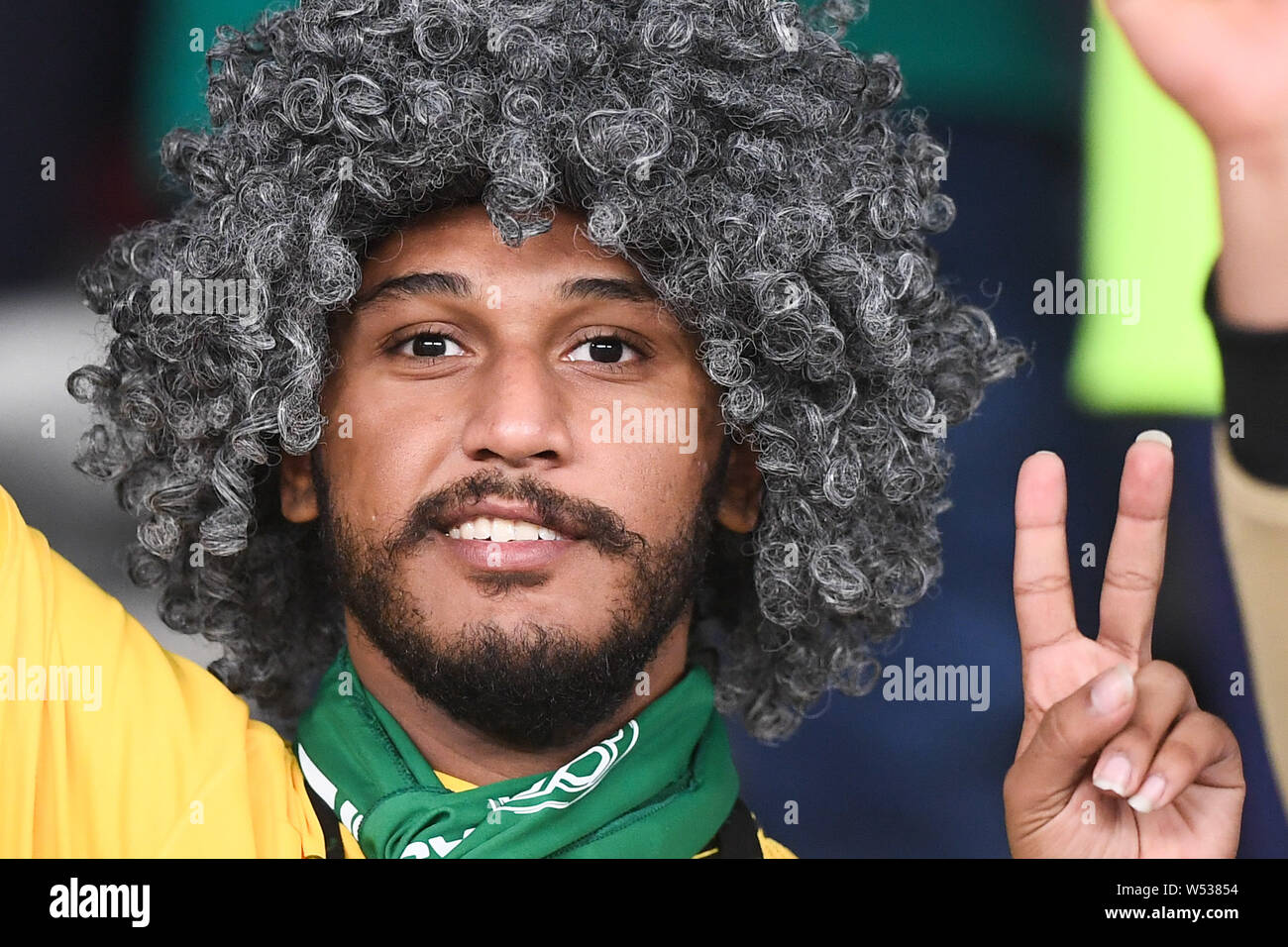 A Saudi Arabian football fan shows support for Saudi Arabia national ...