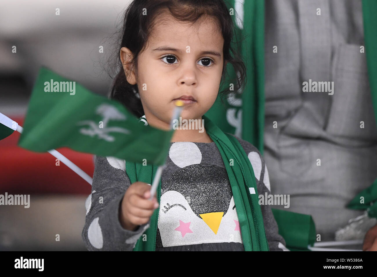 A Saudi Arabian football fan shows support for Saudi Arabia national ...