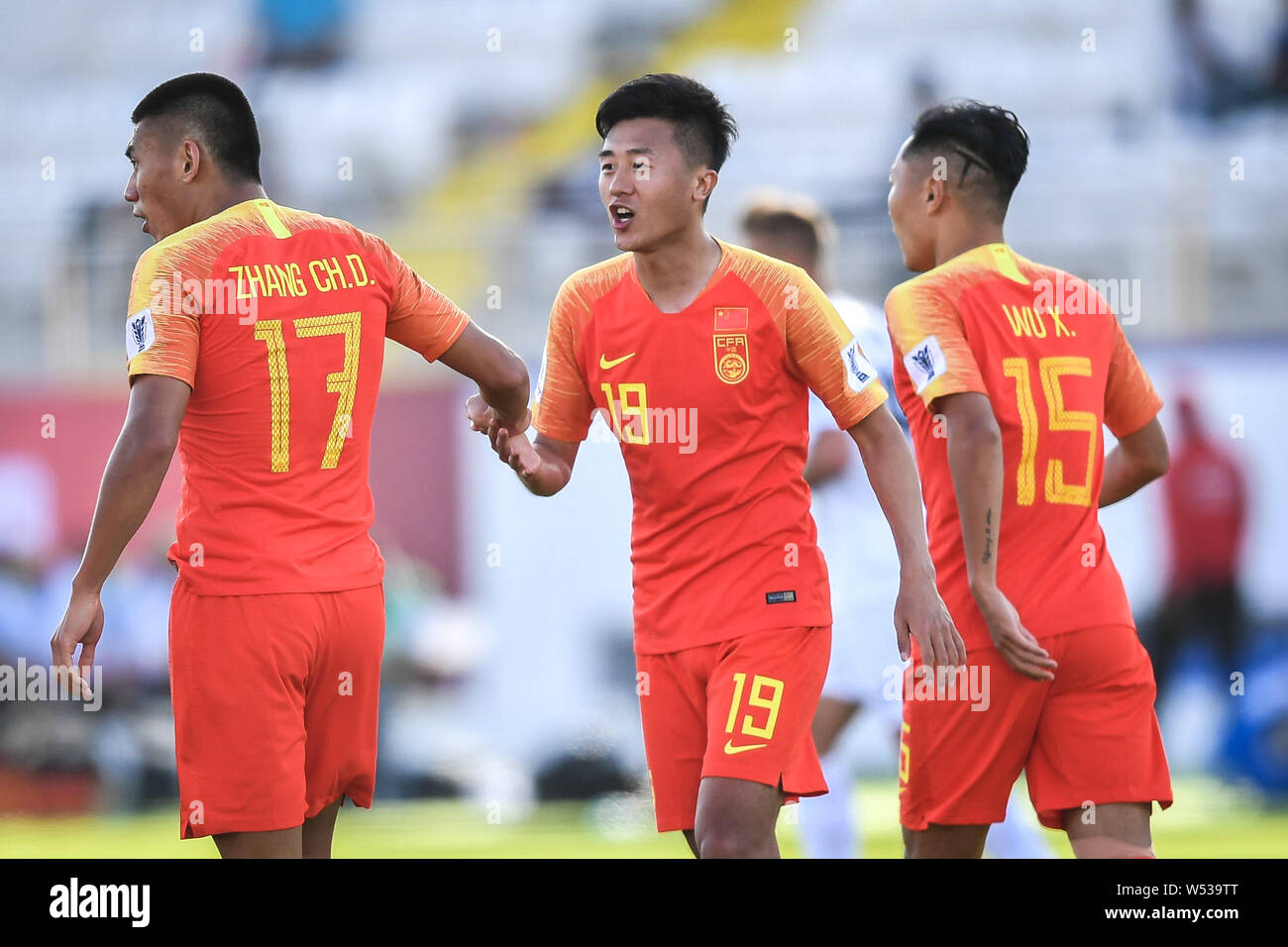 Players of China national football team celebrate after scoring against Kyrgyzstan national ...