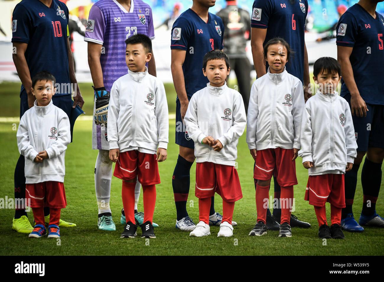 Chinese ball kids pose before the Group A match between Bahrain and ...