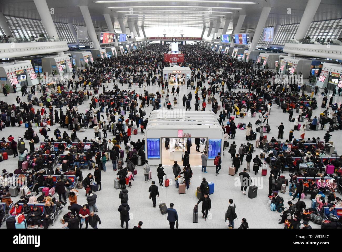 Passengers wait for their trains to go back home for the Chinese Lunar ...