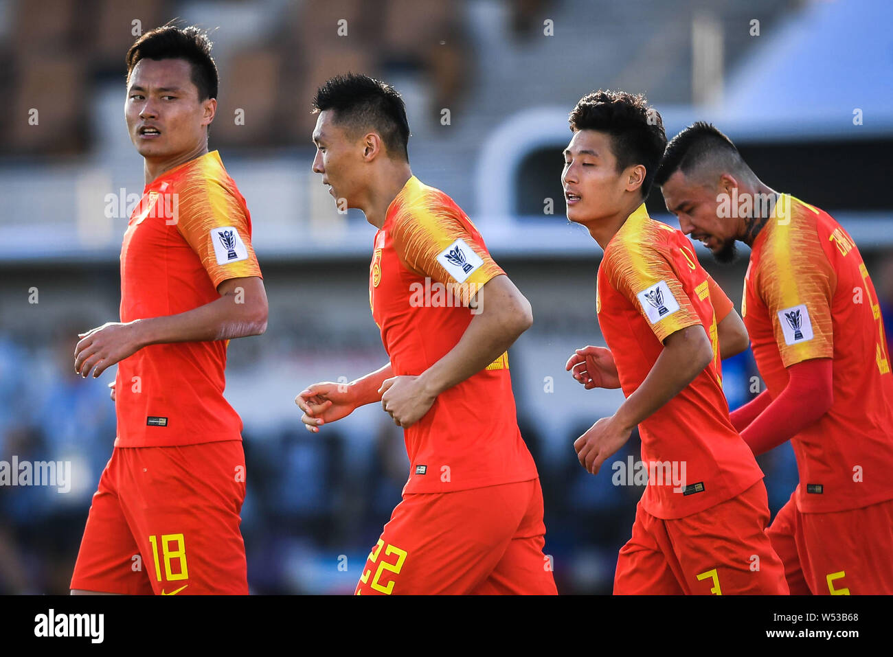 Players of China national football team celebrate after scoring against ...