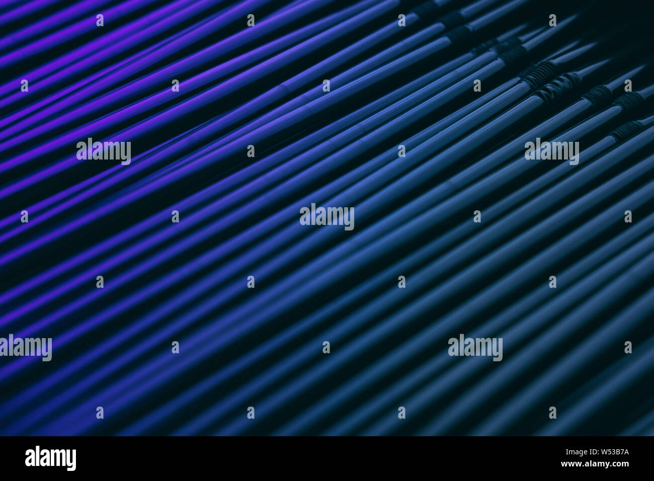 Stainless steel straws vertical abstract background. Metal pipes bundle ...