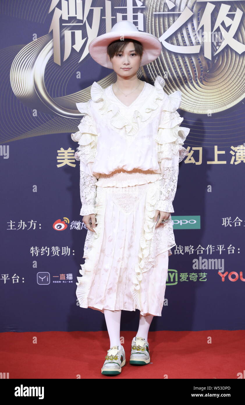 Chinese singer Li Yuchun poses as she arrives on the red carpet for ...