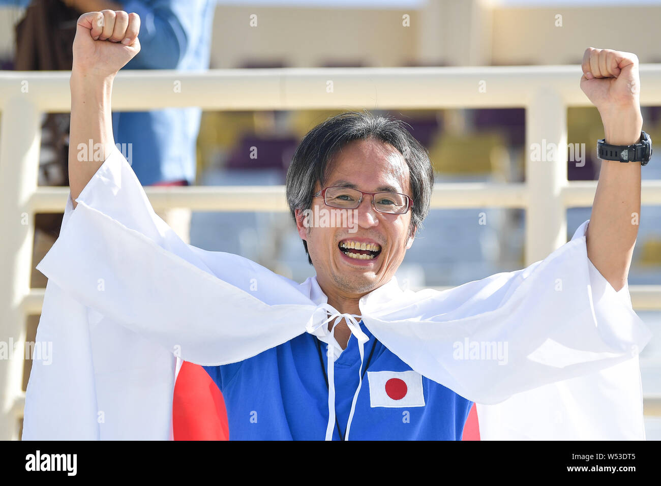 Japanese football fans wave their national flags to show support for ...