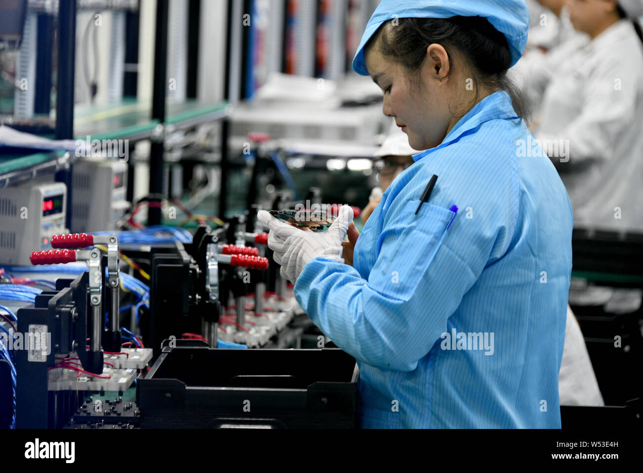 --FILE--A Chinese worker produce artificial intelligence produces on ...