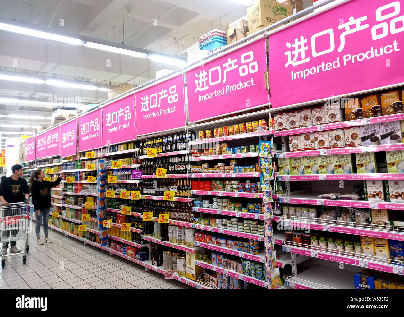 --FILE--Consumers choose imported products at a supermarket in Shanghai ...
