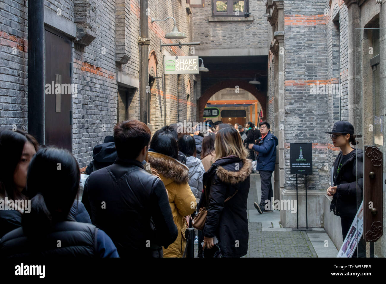 Customers queue up in front of China's first branch Shake Shack at the ...