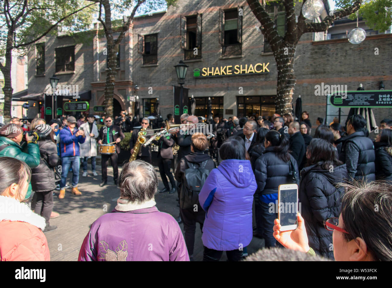 Customers queue up in front of China's first branch Shake Shack at the ...