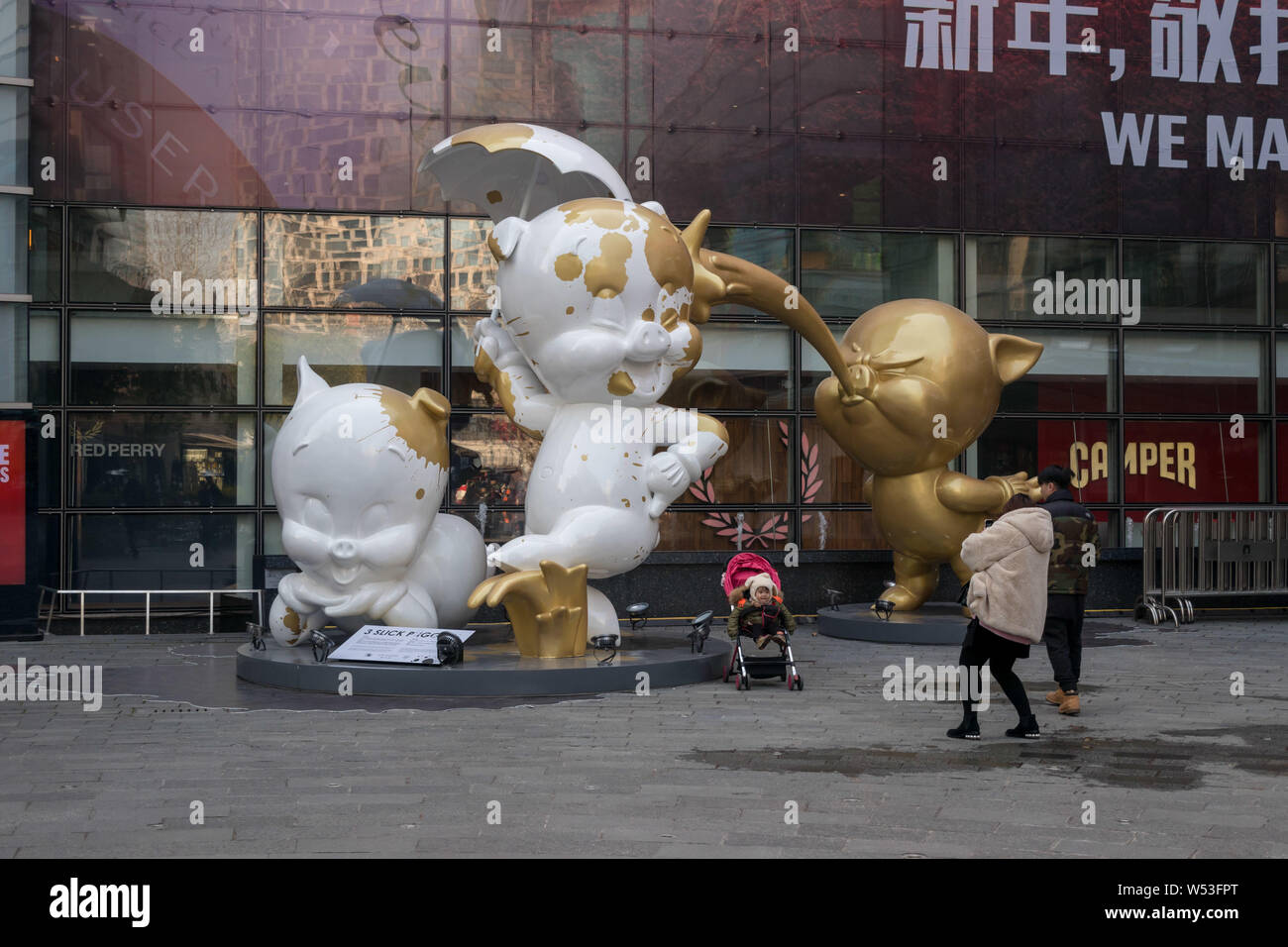 View of the "3 Slick Piggies" installation by OG Slick on display at ...