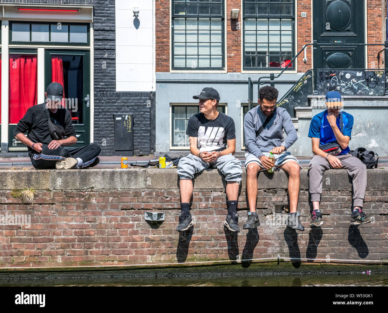 Group young men wall hi-res stock photography and images - Alamy