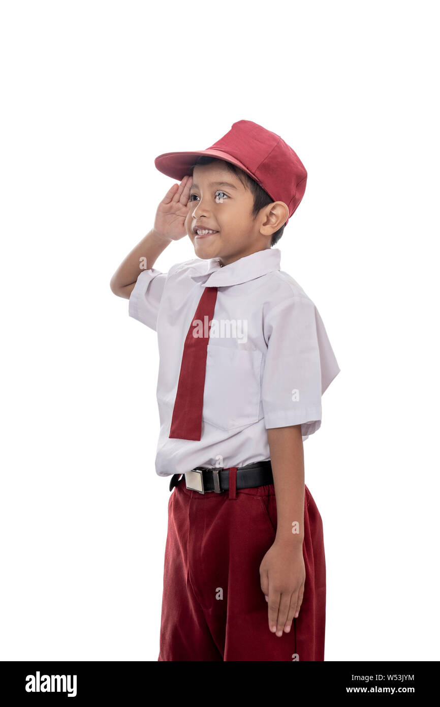 student giving salute while indonesia flag being raised Stock Photo - Alamy