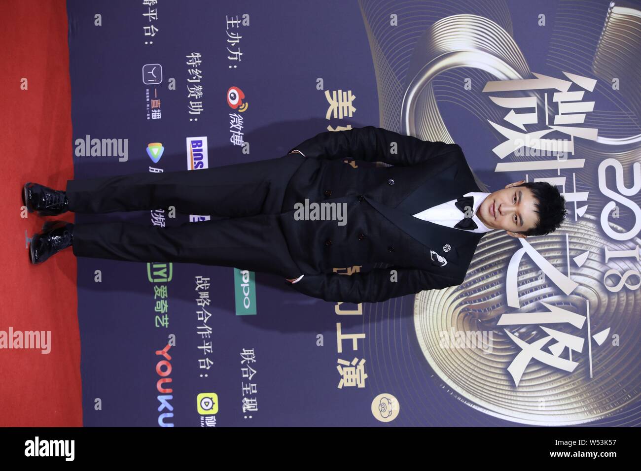 Chinese actor Huang Xiaoming poses as he arrives on the red carpet for ...