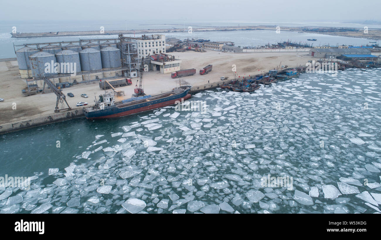 Aerial view of thick sea ice on the frozen sea surface at Laizhou Bay ...