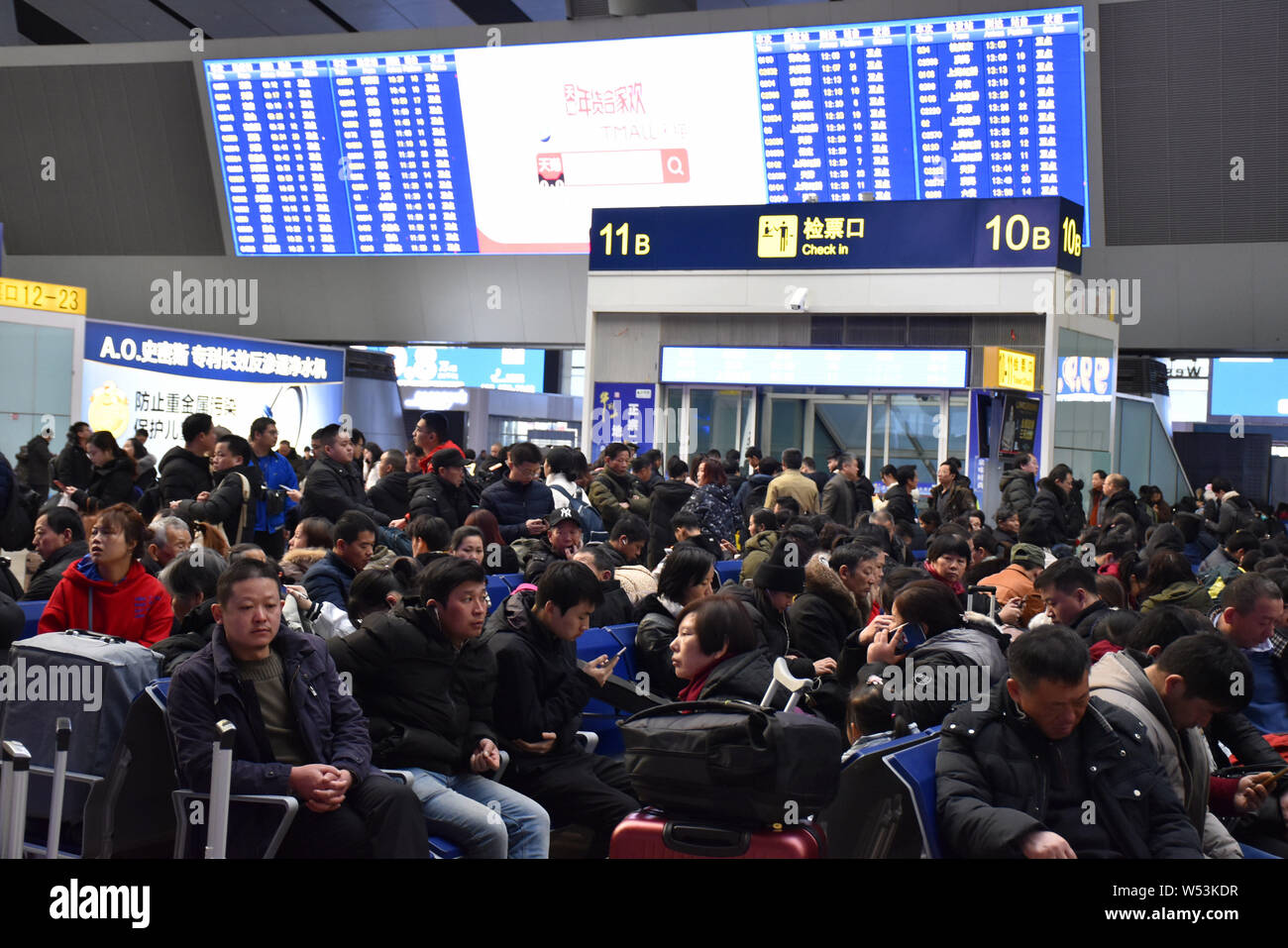 Passengers wait for their trains during the Chinese Lunar New Year ...