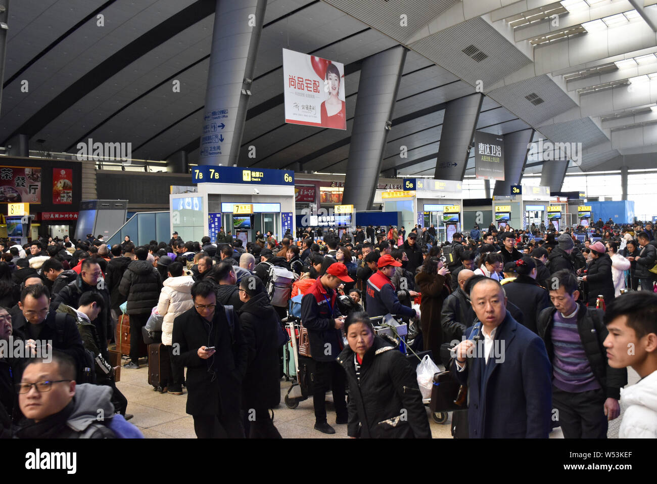 Passengers wait for their trains during the Chinese Lunar New Year ...