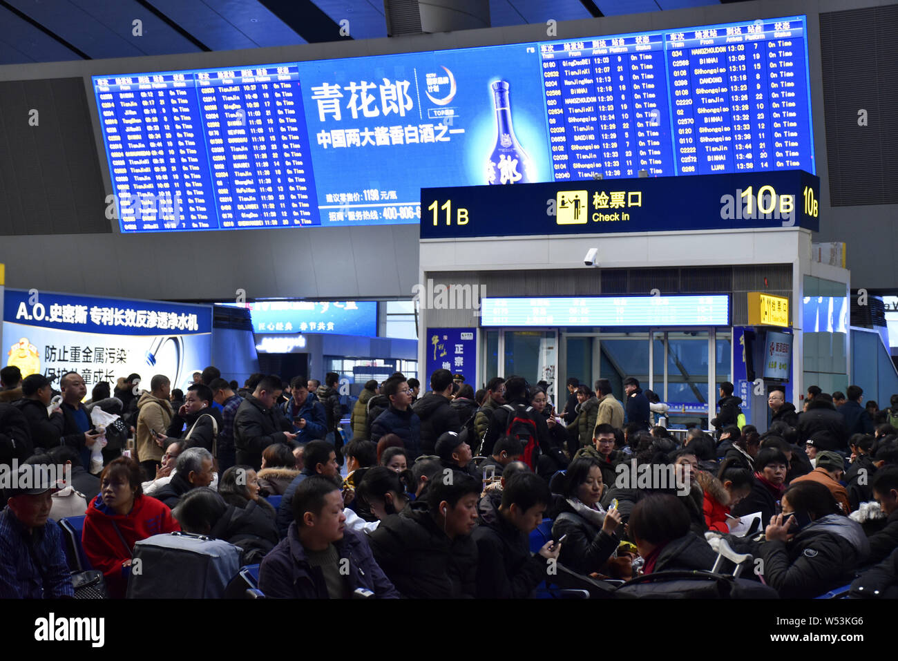 Passengers wait for their trains during the Chinese Lunar New Year ...