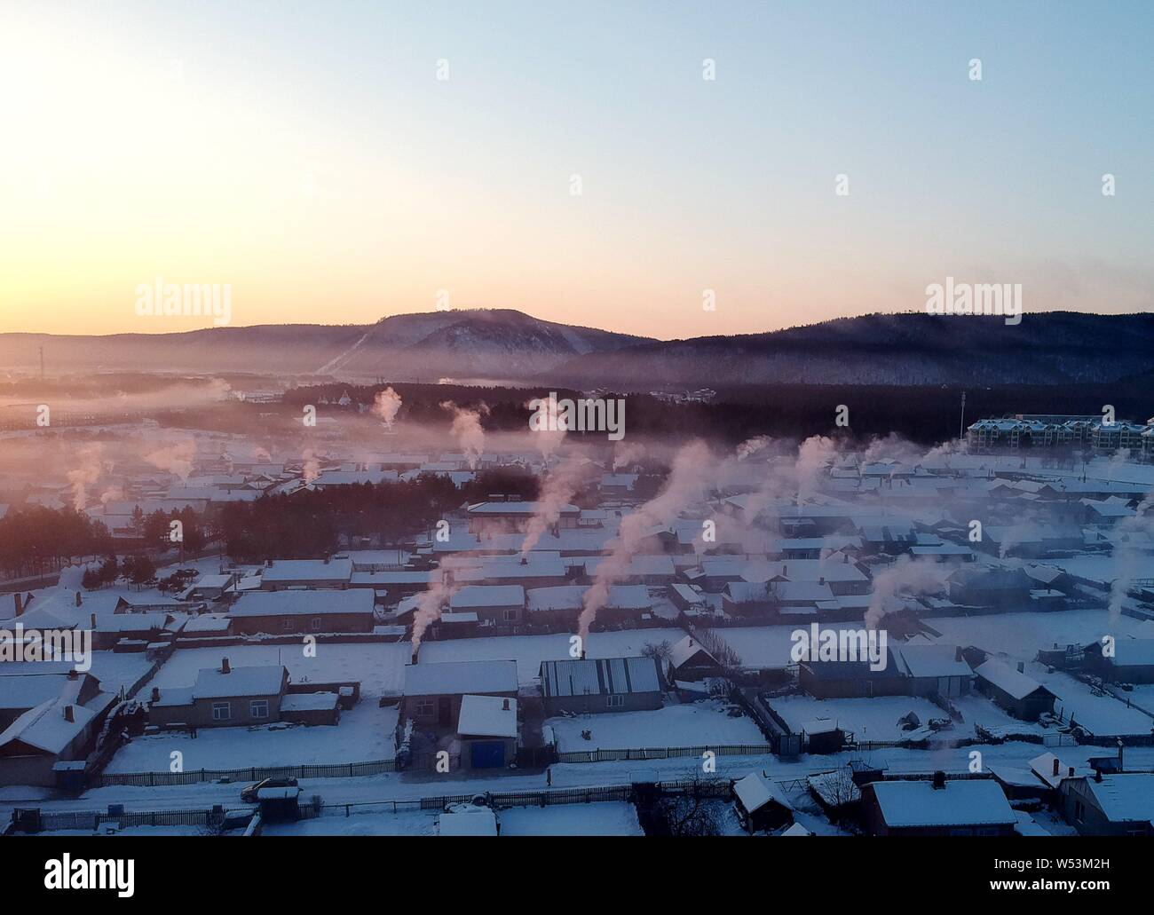 Ice fog rise from residential builings in Beiji Village of Mohe city ...
