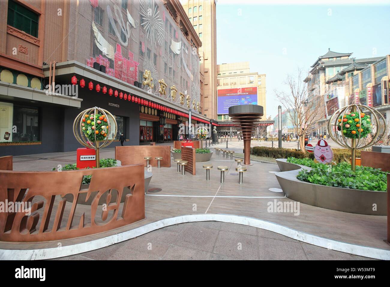 A large, open air smoking area featuring 18 stainless steel seats, 13 ...