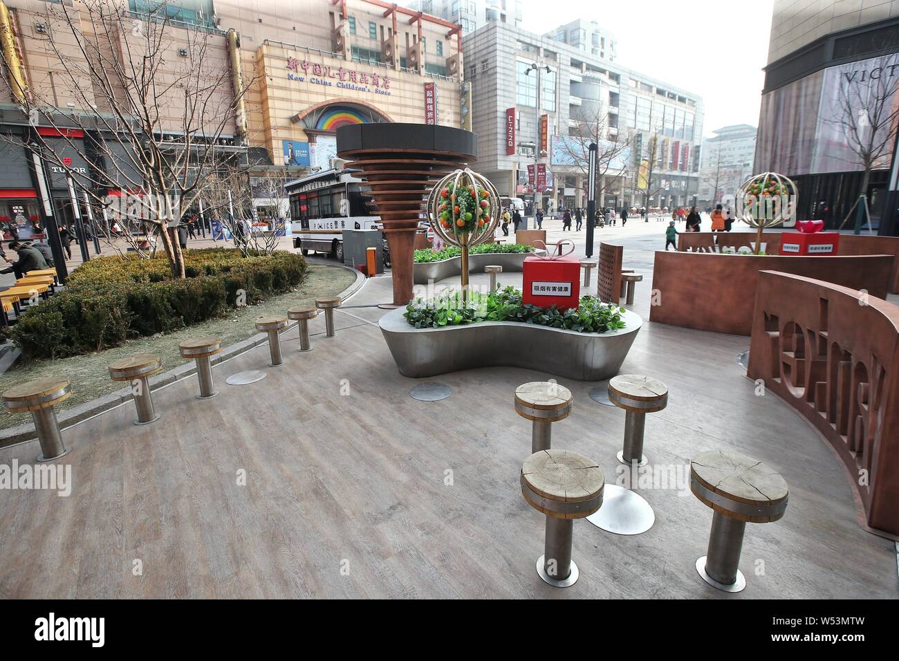A large, open air smoking area featuring 18 stainless steel seats, 13 ...