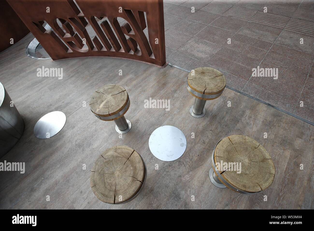 A large, open air smoking area featuring 18 stainless steel seats, 13 ...