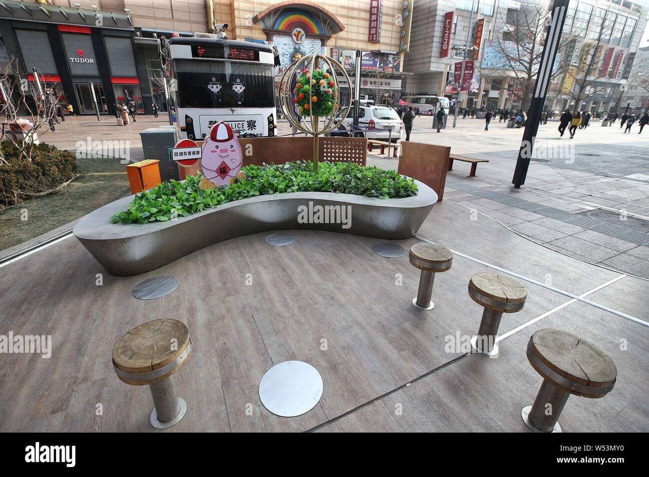 A large, open air smoking area featuring 18 stainless steel seats, 13 ...