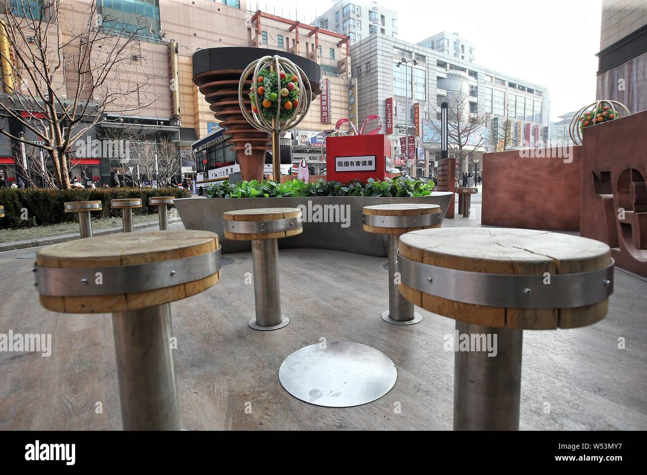 A large, open air smoking area featuring 18 stainless steel seats, 13 ...