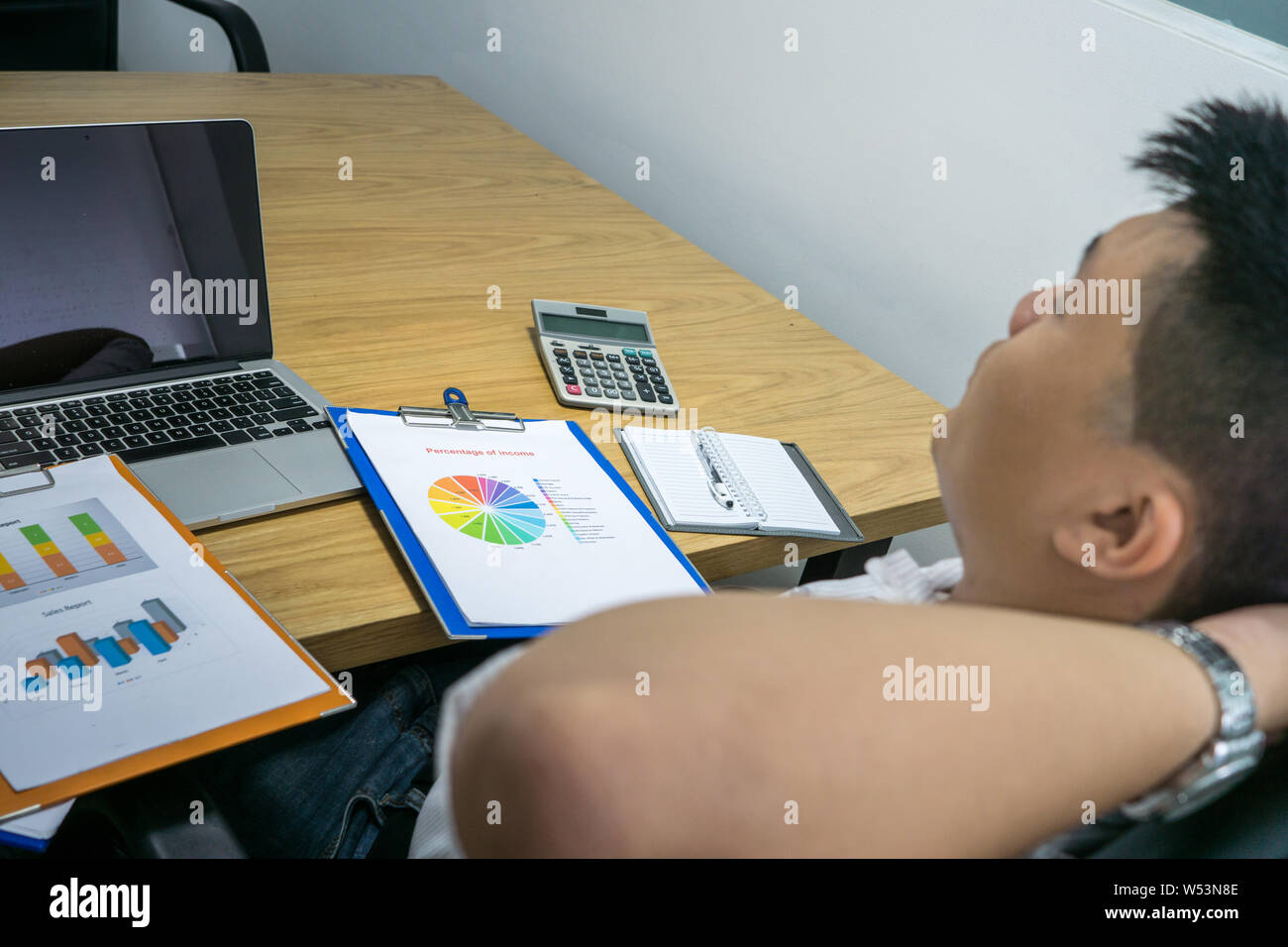 Asian guy hands behind the head hi-res stock photography and images - Alamy