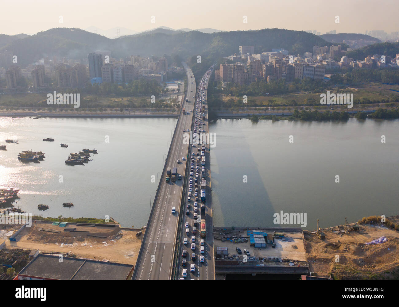 A large number of vehicles move slowly during a traffic jam during the ...