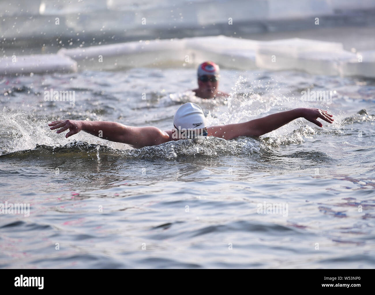 Chinese winter swimming lovers swim in the freezing water to celebrate ...