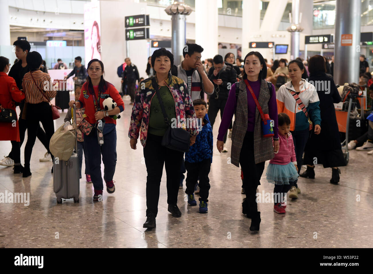 Passengers wait for their trains during the Spring Festival travel rush ...