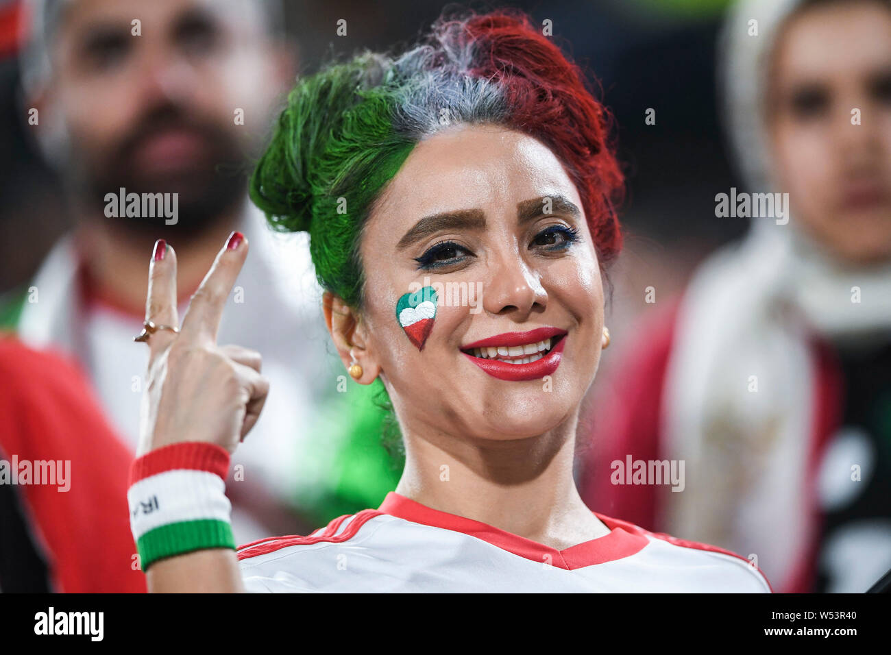 Iran fans wave slogans and national flags to show support to Iran ...