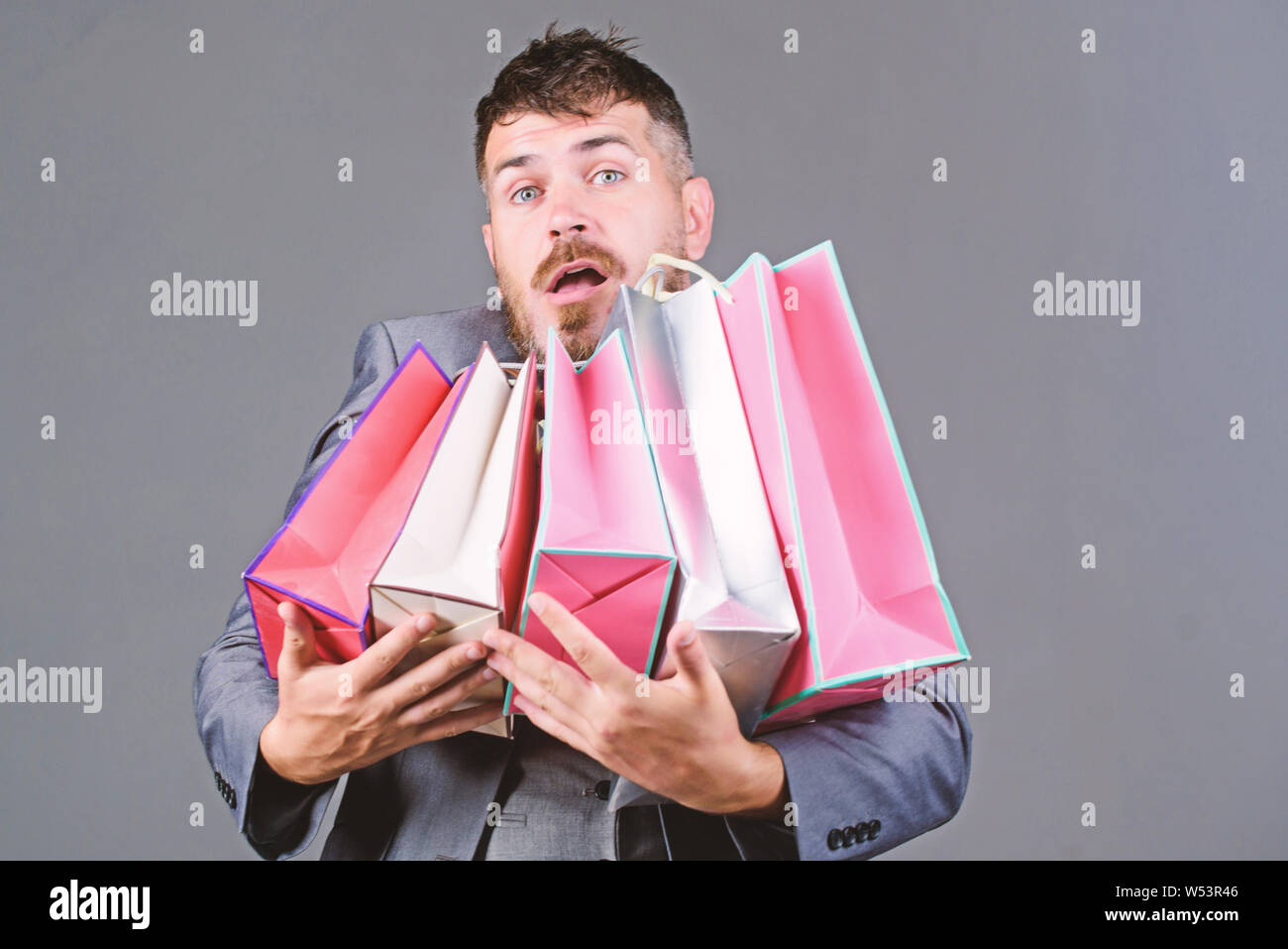 Man carrying heavy bags hi-res stock photography and images - Alamy