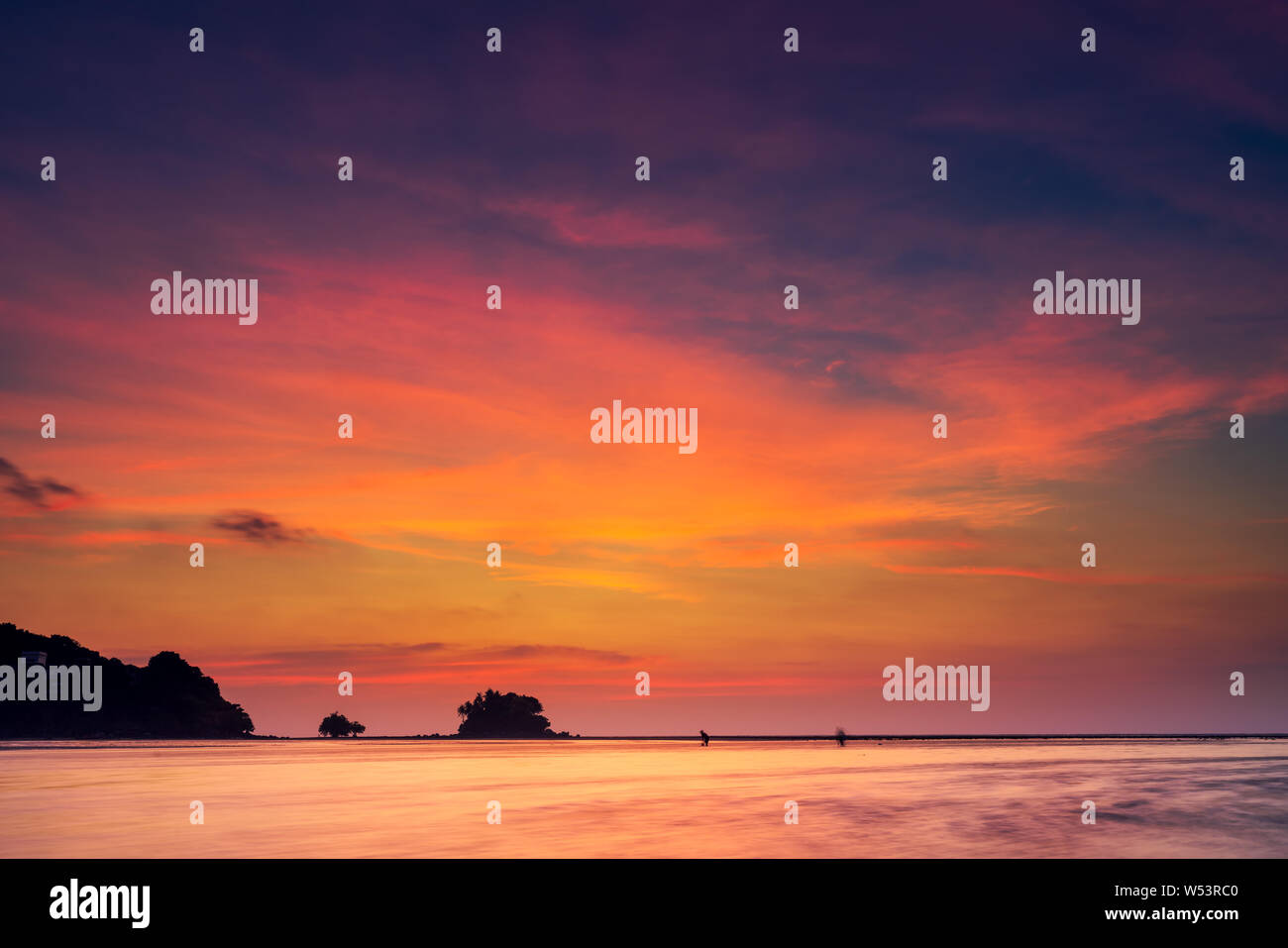 Colorful sunset on tropical beach in Asia Stock Photo - Alamy