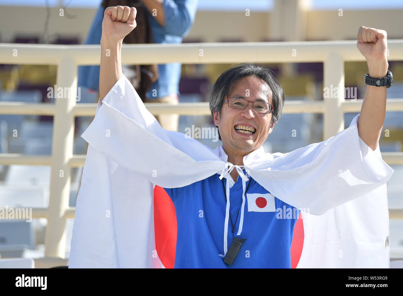 Japanese football fans wave their national flags to show support for ...