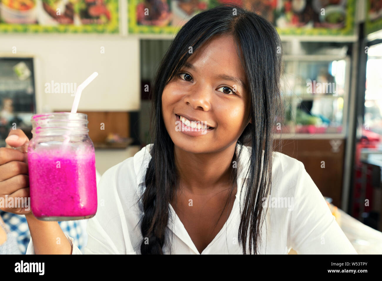 Woman holding dragon fruit hi-res stock photography and images - Alamy