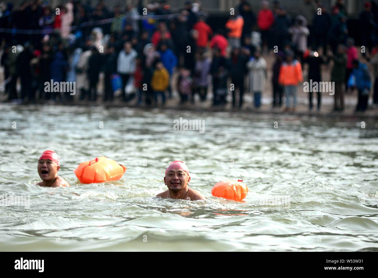 Chinese winter swimming lovers swim in the freezing water of the Yellow ...