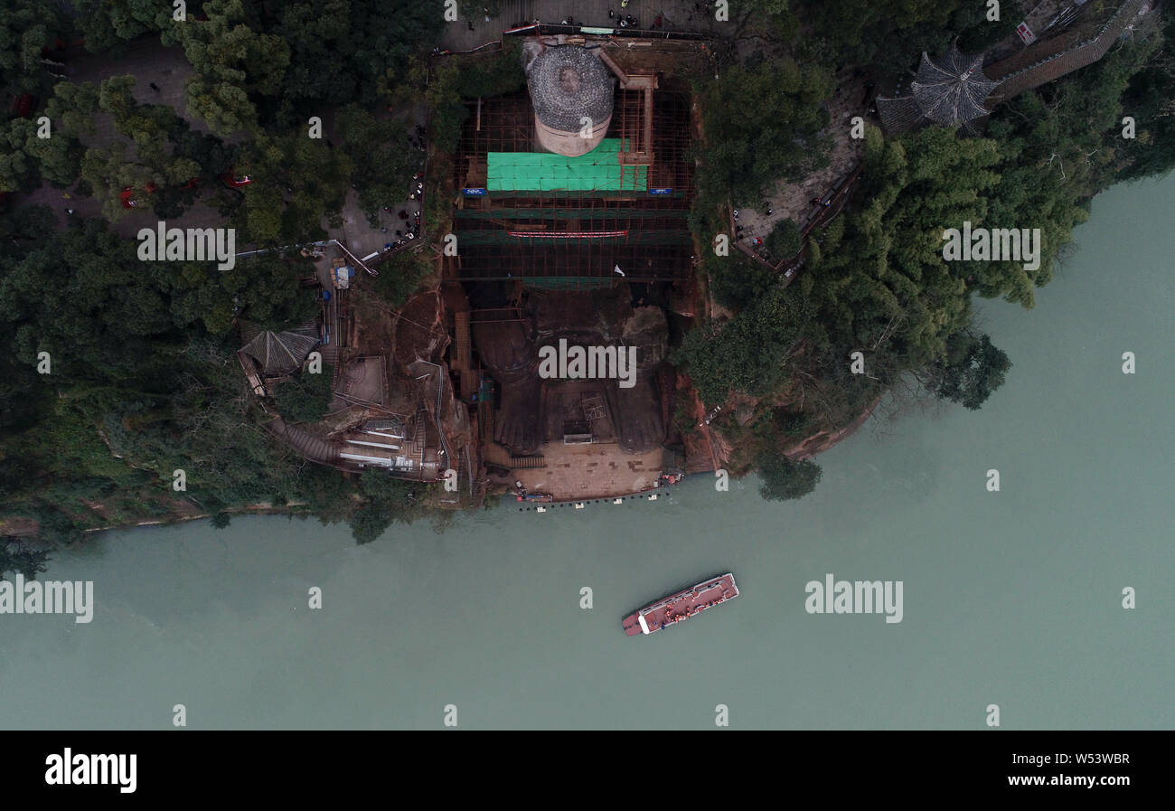The Leshan Giant Buddha is covered with scaffolding for a restoration ...