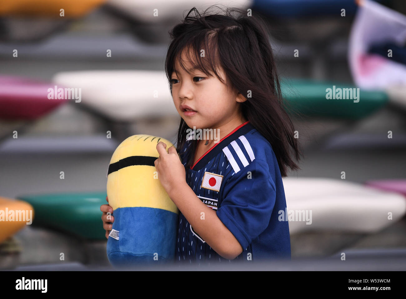 Japanese football fans wave their national flags to show support for ...