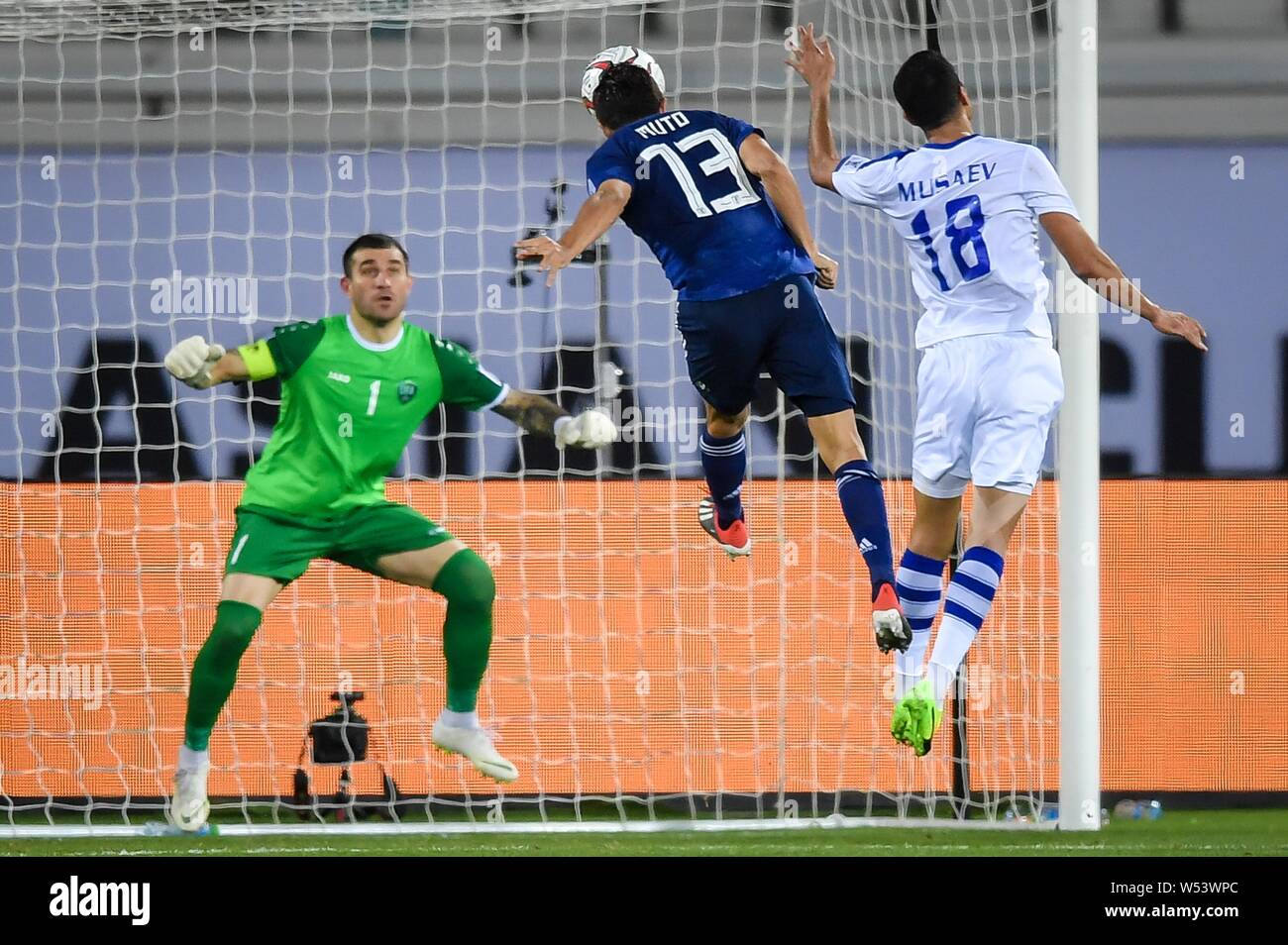 Yoshinori Muto, top, of Japan national football team heads the ball ...