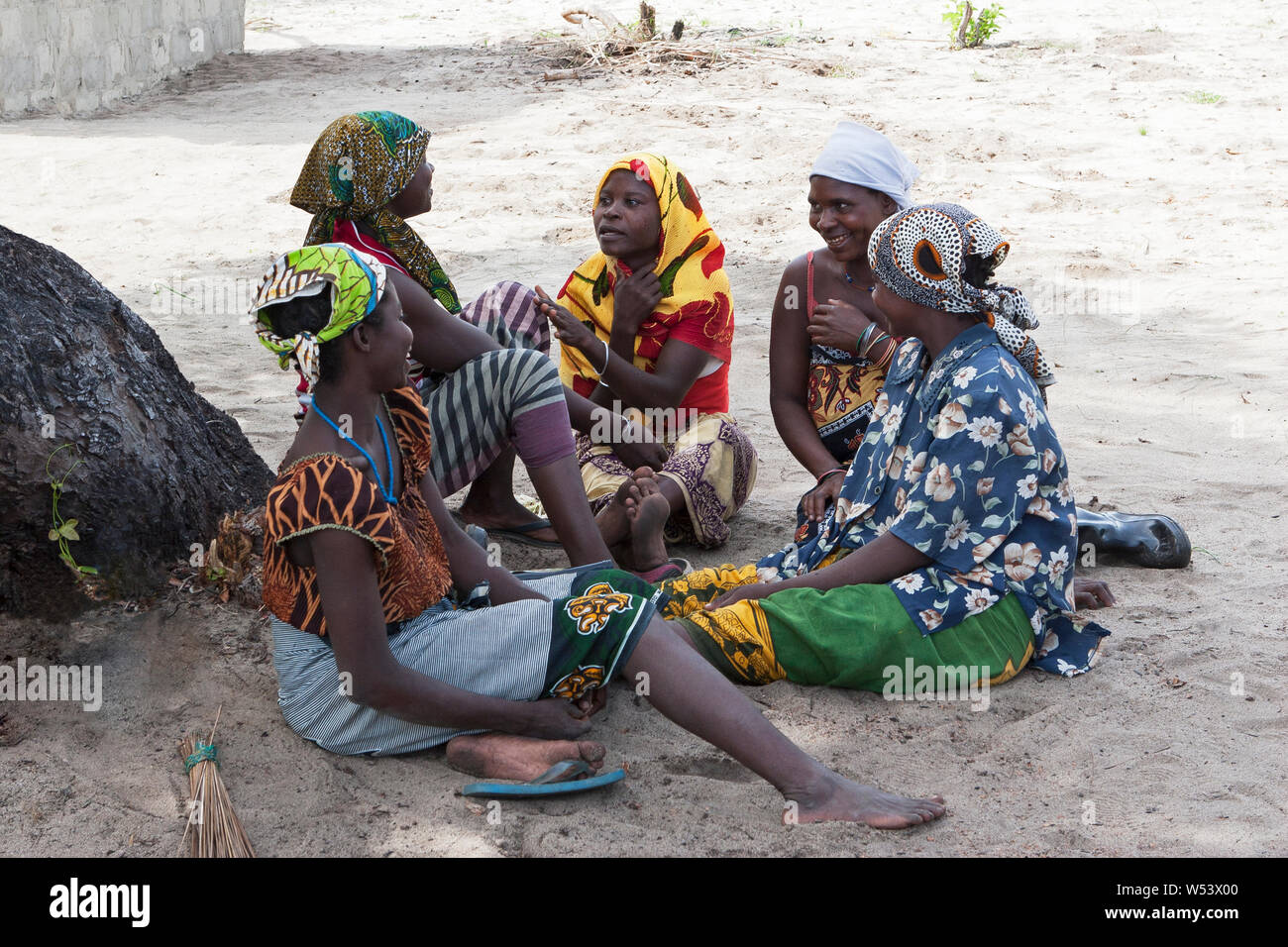 Local village African women chatting, supported by mine development ...