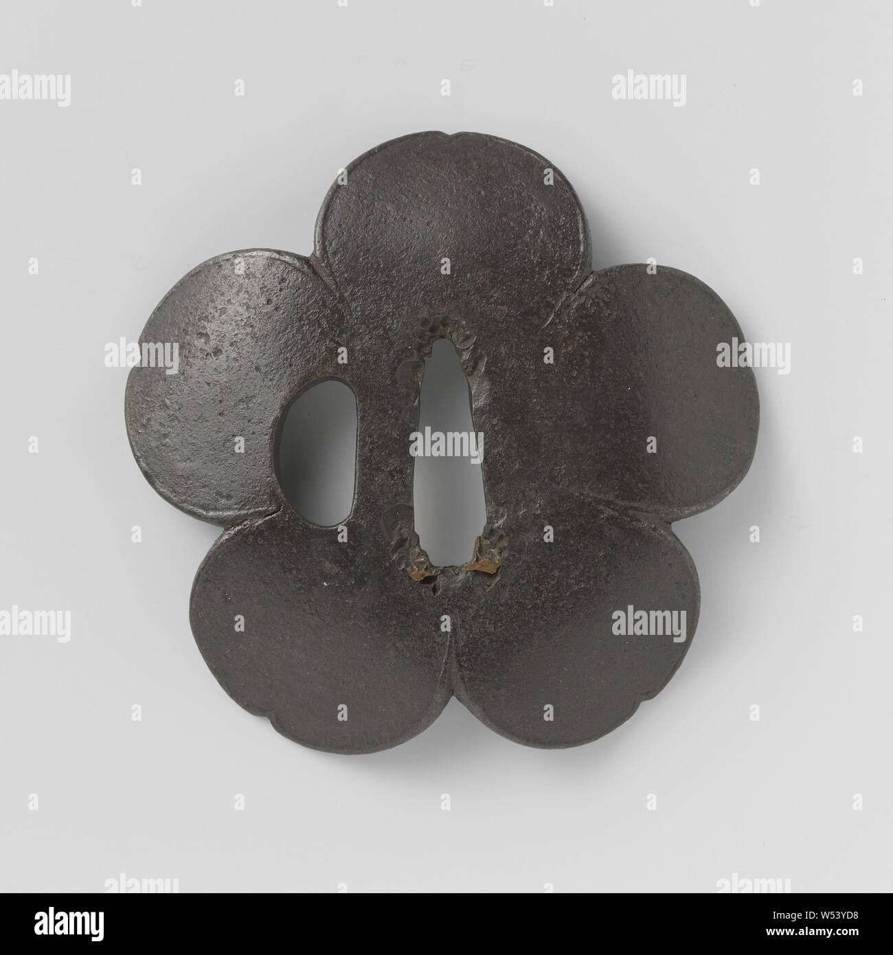 Hand guard, Tsuba in the shape of a cherry blossom with five rising ...