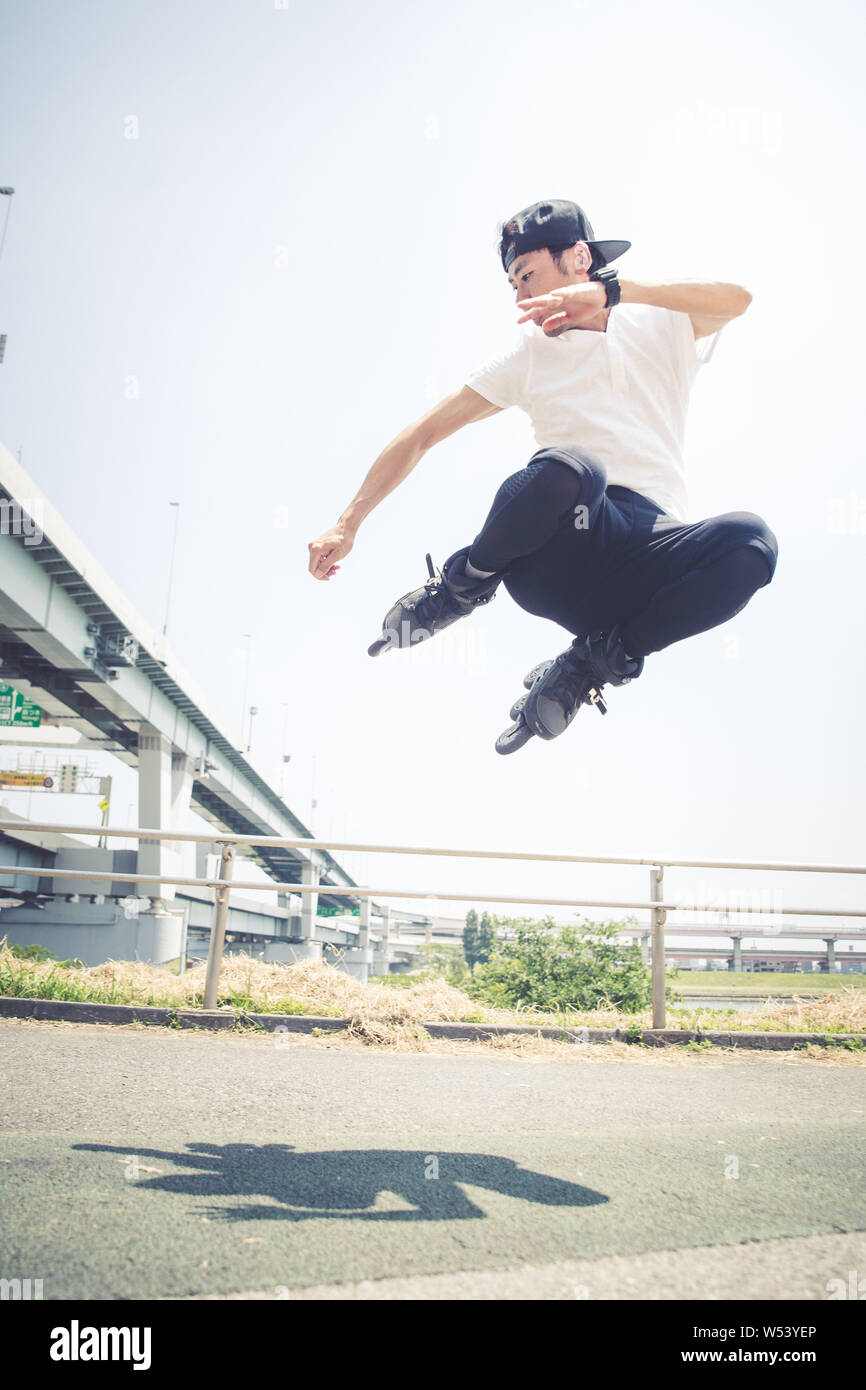 Japanese skater Kenji Akiyama showing his jumping skills Stock Photo ...