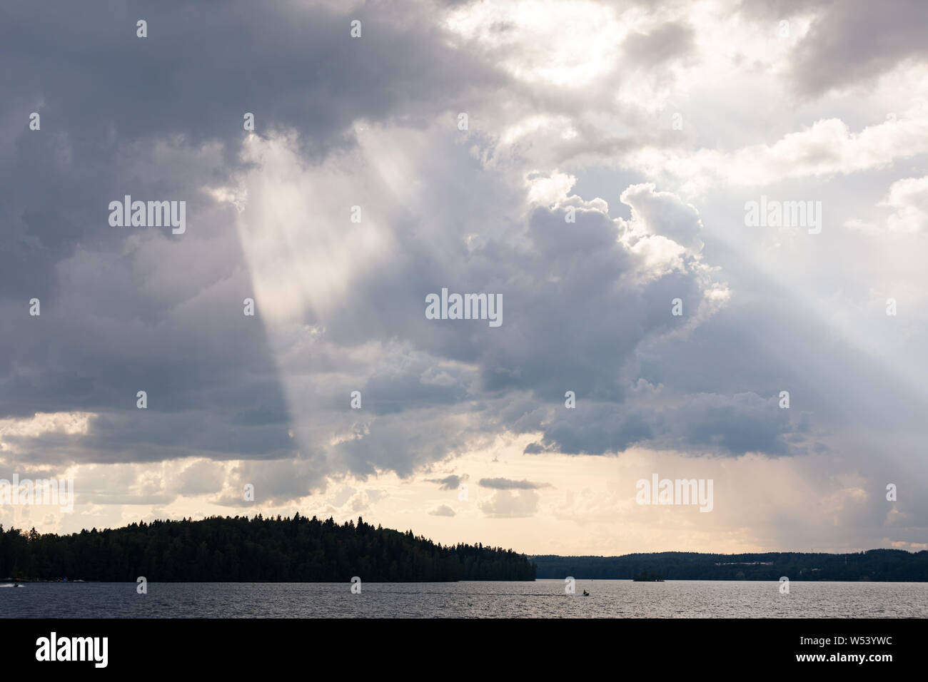 Vivid sunbeam light ray from clouds Stock Photo - Alamy