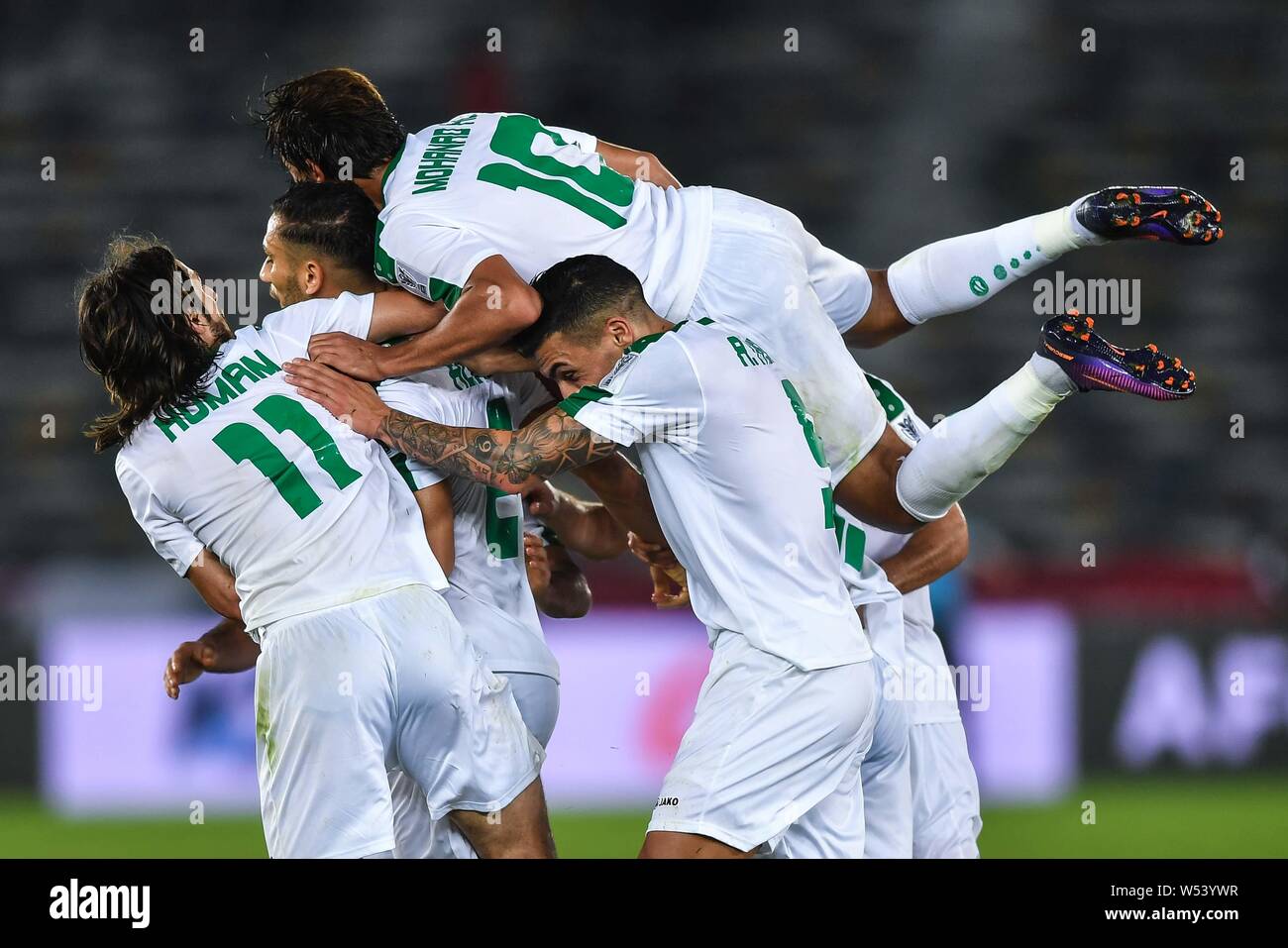 Players of Iraq national football team celebrate after scoring against ...