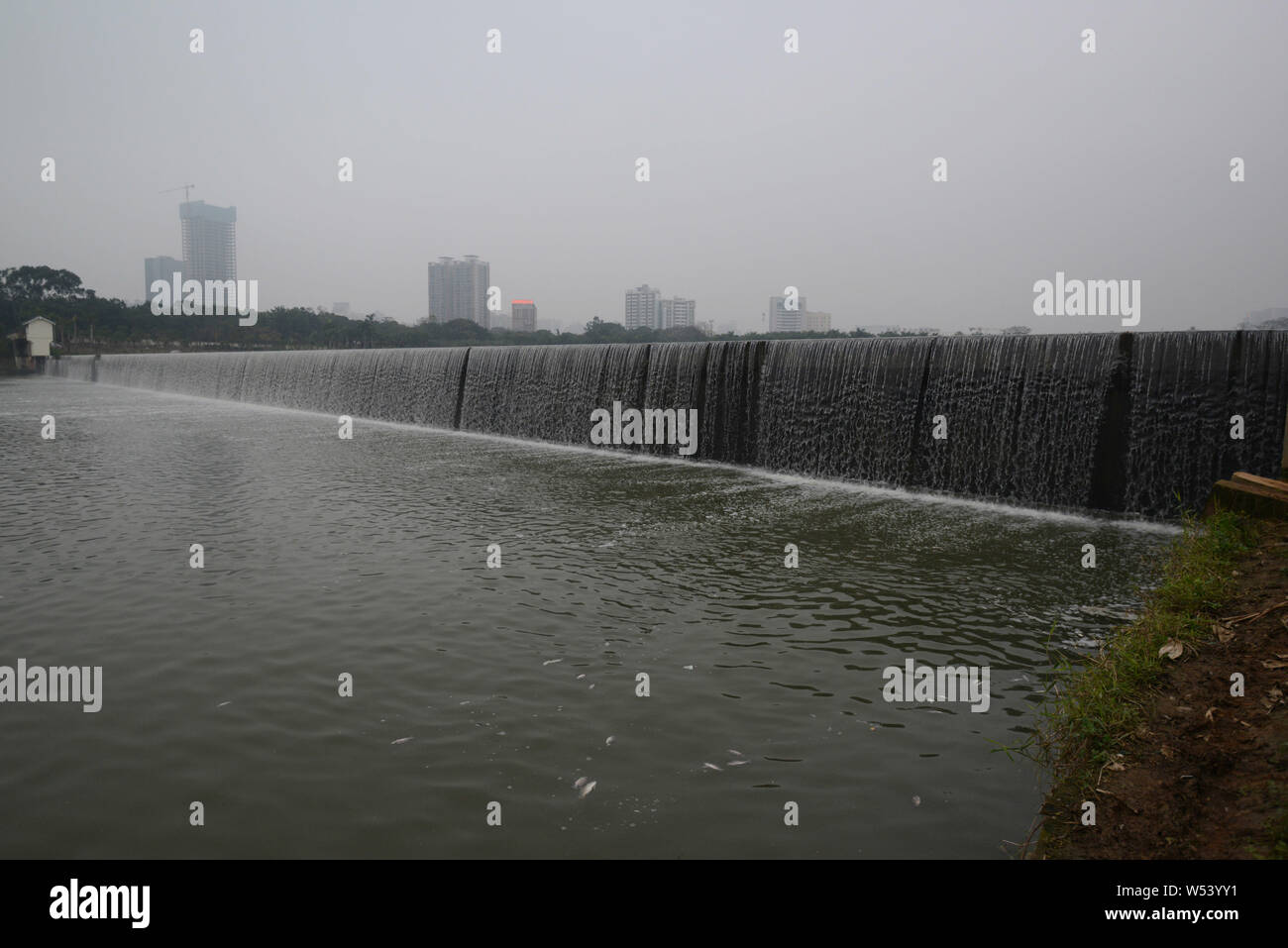 A view of an giant artificial waterfall in the middle of Xinxu River in ...